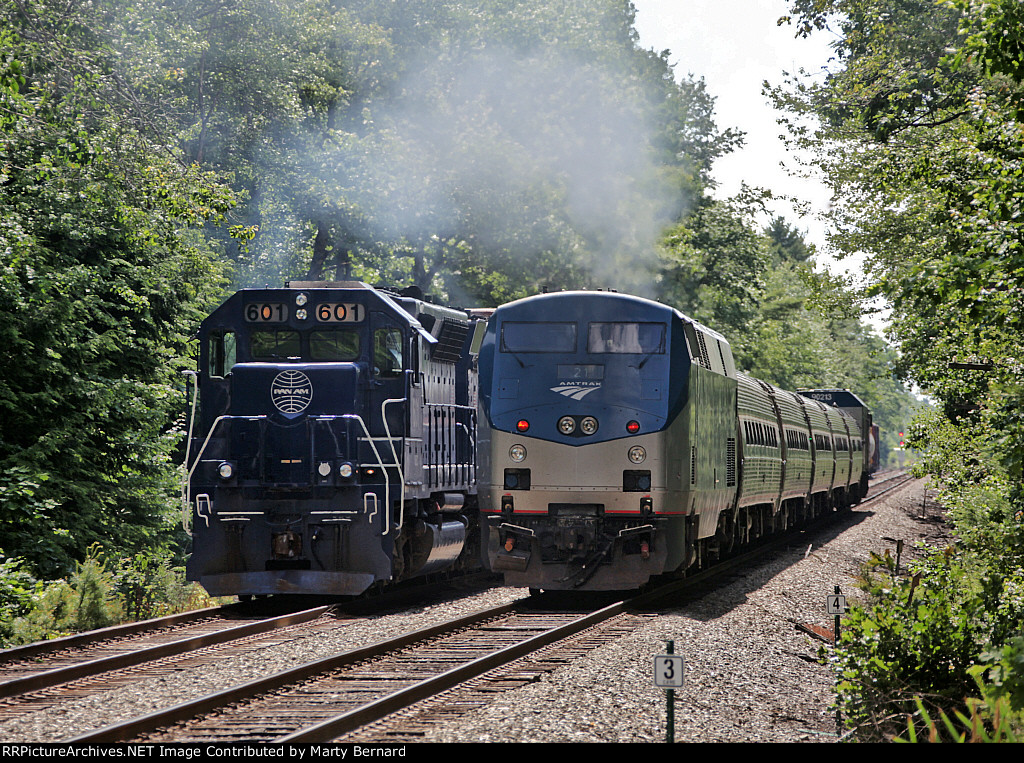 AMTK 21 Pushing Departing Tr. 696 While Pan Am Freight Awaits a Crew